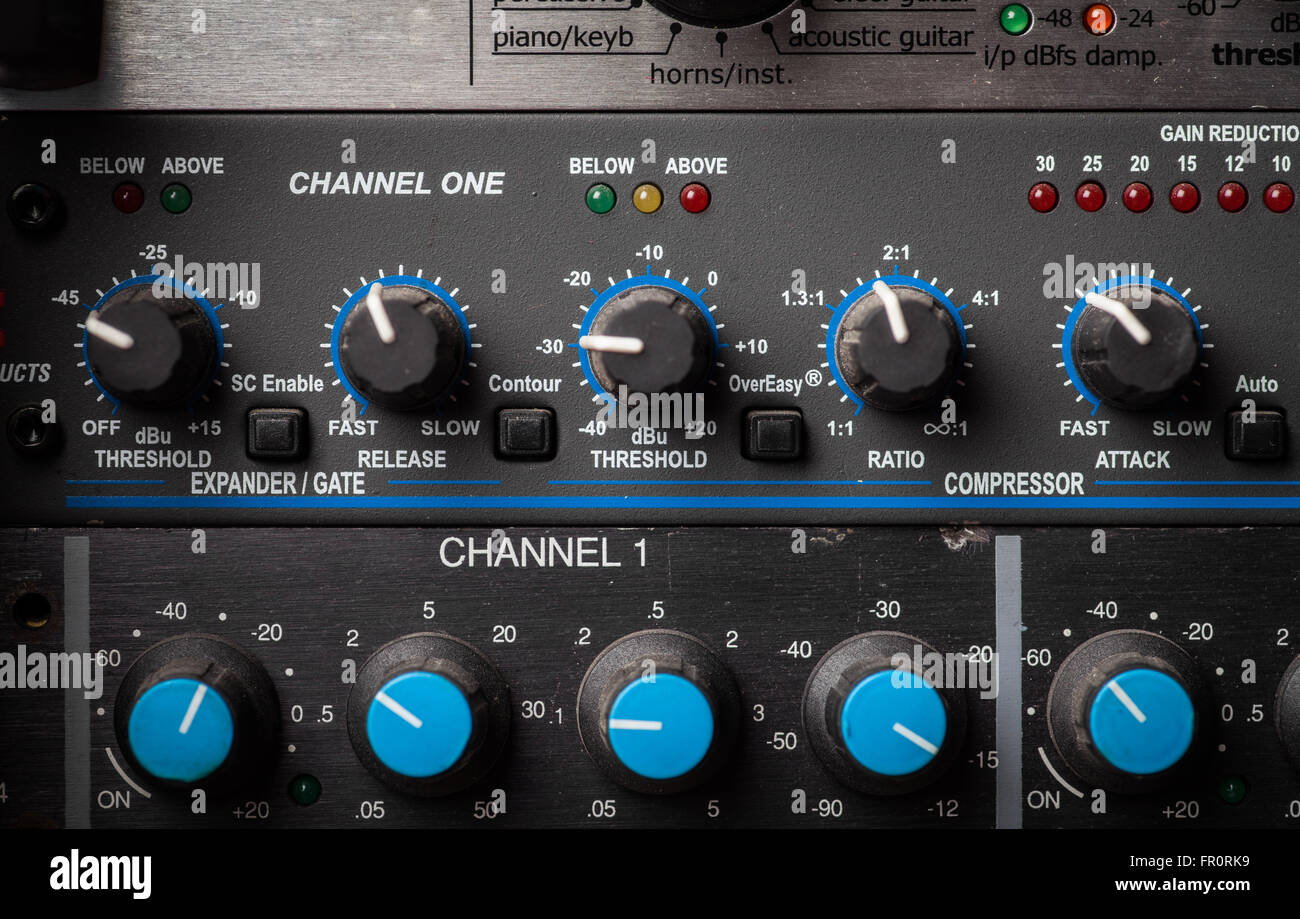 Color image of many buttons on a sound mixer in a recording studio ...