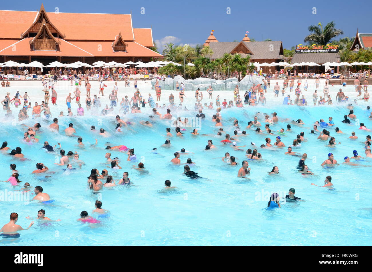 Lots of tourists enjoying artificial wave in Siam Park on Tenerife ...