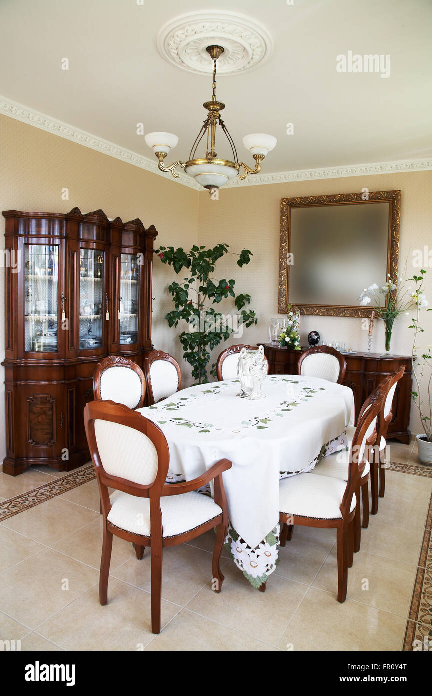 Table and chairs in a room of the smart house Stock Photo - Alamy