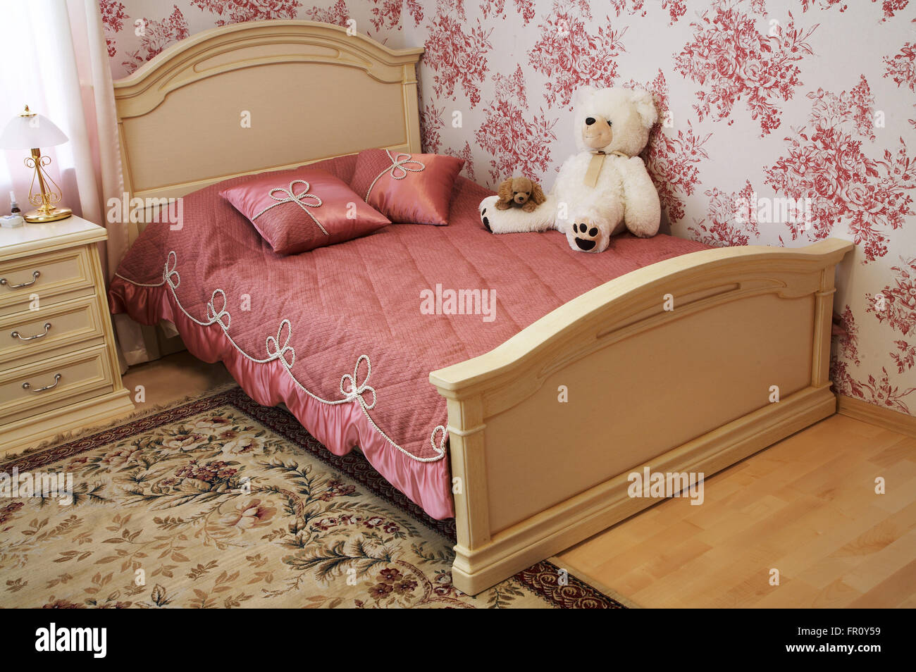 Toys on a bed in a modern bedroom Stock Photo - Alamy