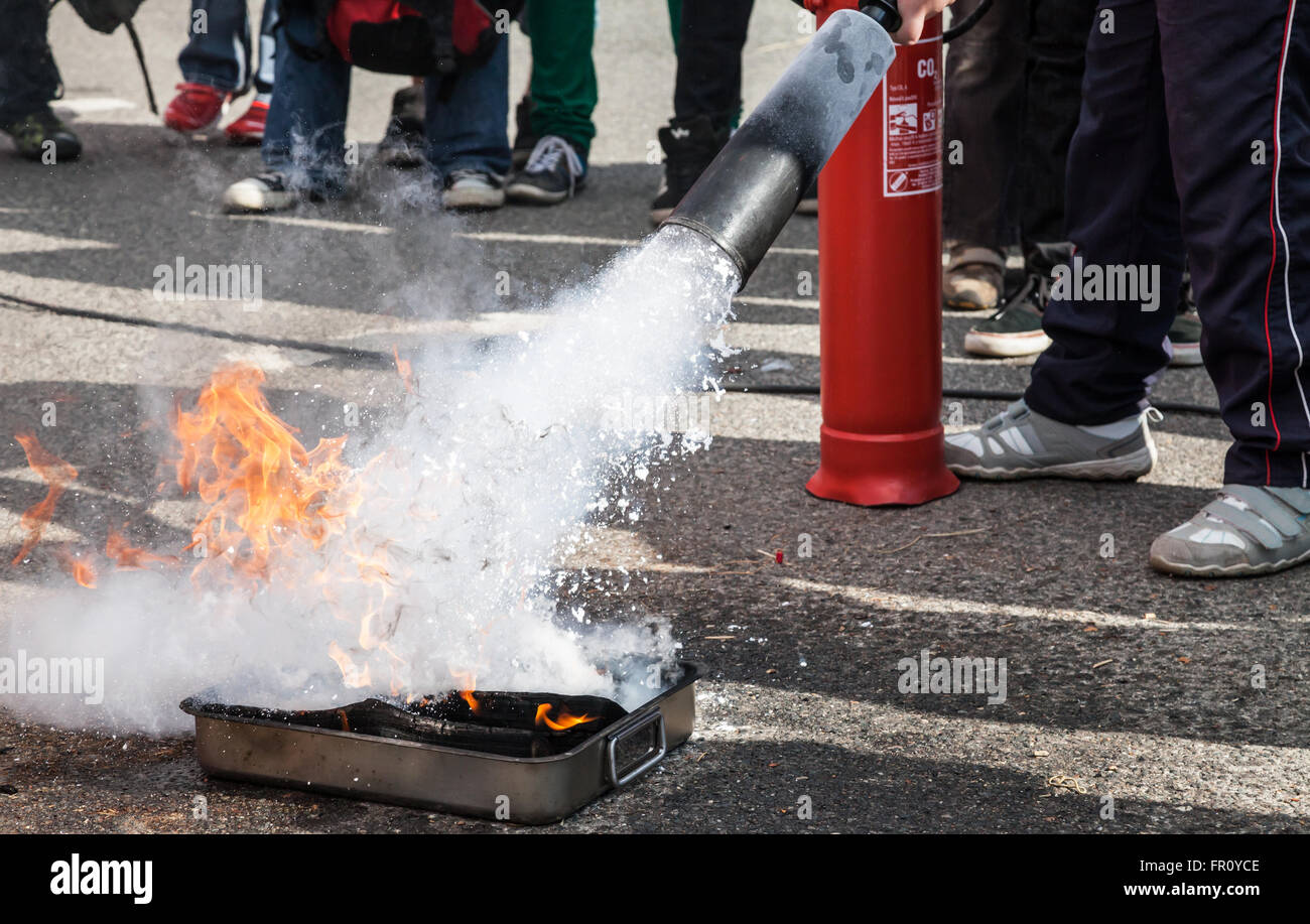 Fighting fire powder extinguisher hi-res stock photography and images ...