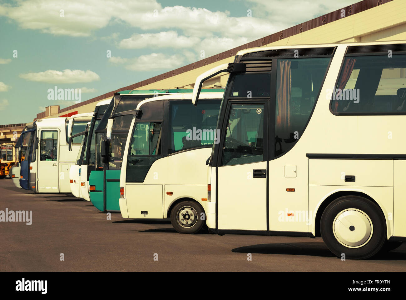buses at the bus station with cloudy sky Stock Photo - Alamy