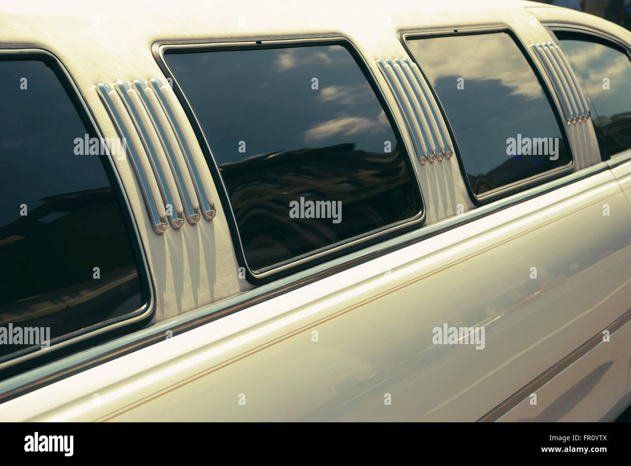 White wedding limousine long side view with windows Stock Photo - Alamy