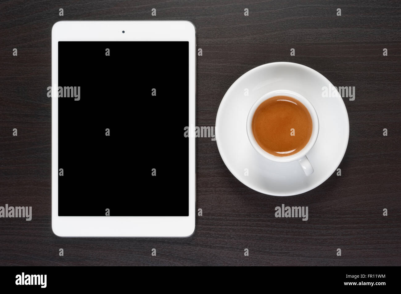Touch tablet and coffee on office table Stock Photo - Alamy