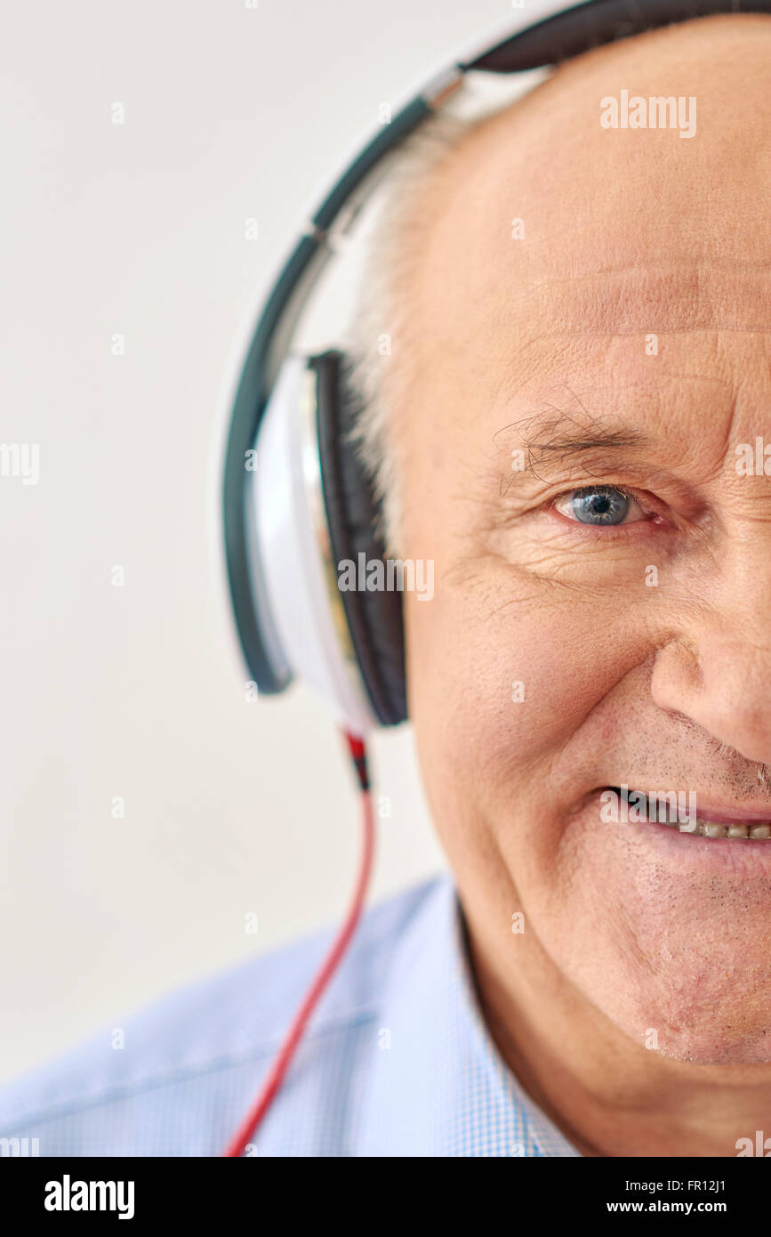 Grandpa listens to music Stock Photo - Alamy