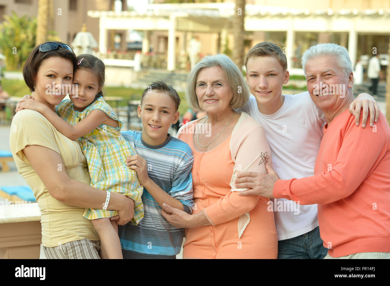 Family relaxing at resort Stock Photo - Alamy