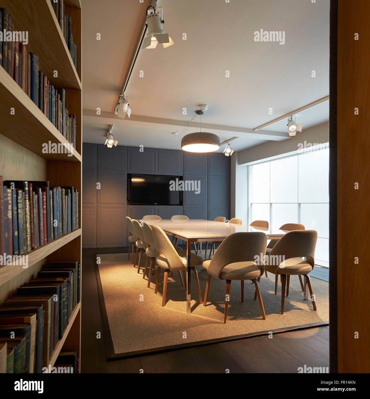 Bookshelf and entrance to meeting room. Fold 7 Offices, London, United ...