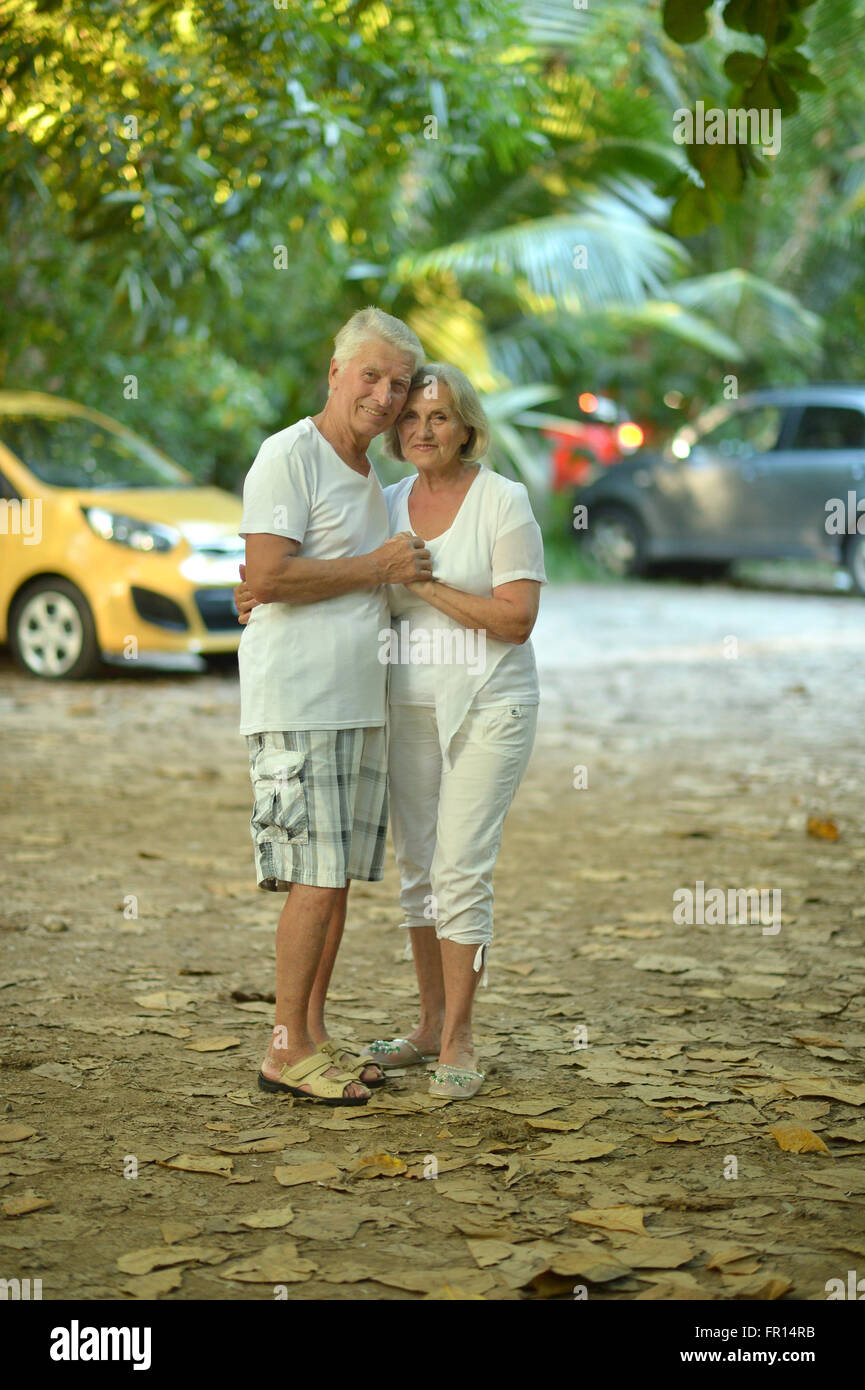 elderly couple rest at tropical resort Stock Photo - Alamy