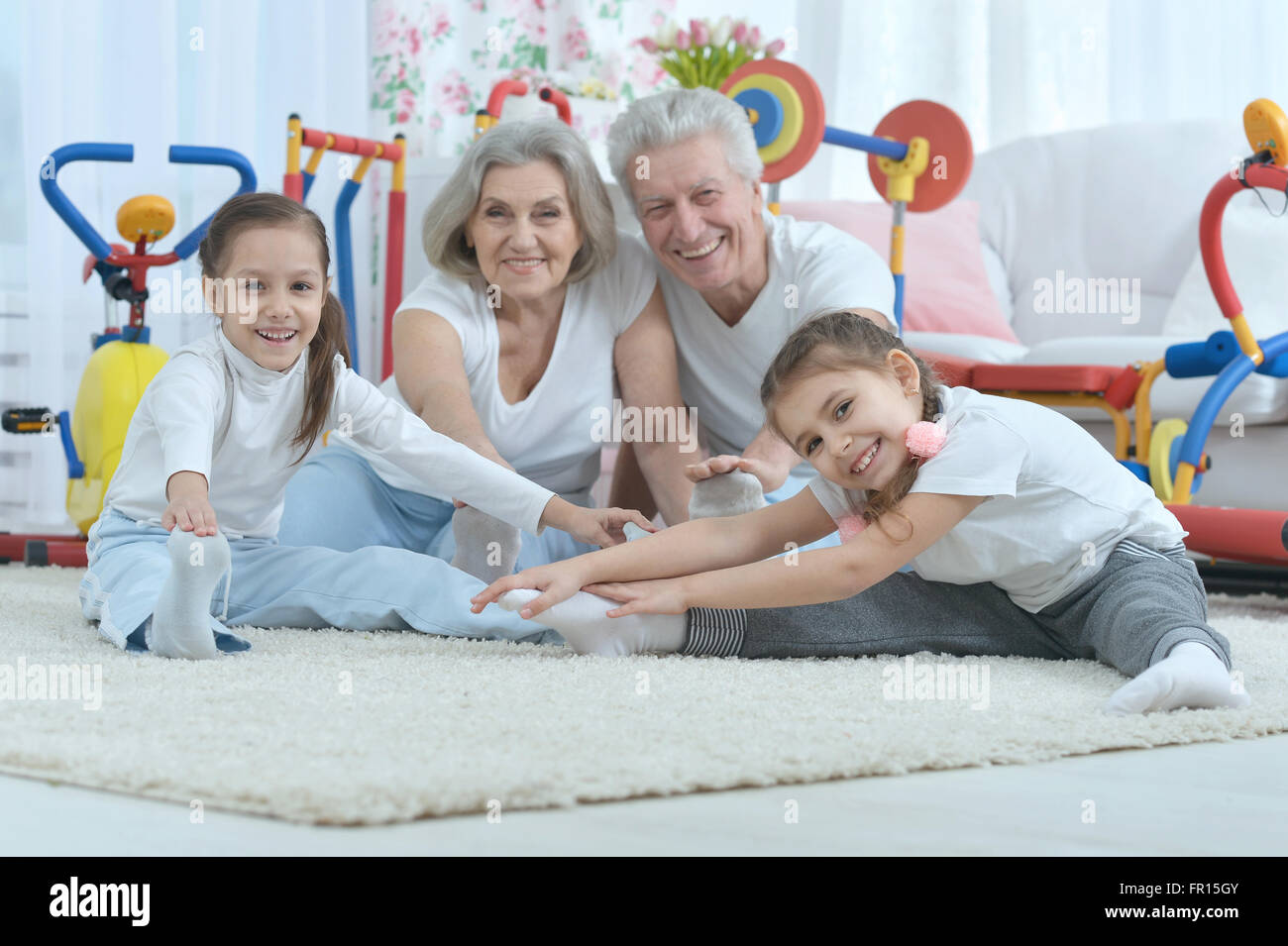 grandparents and granddaughters doing exercise Stock Photo - Alamy