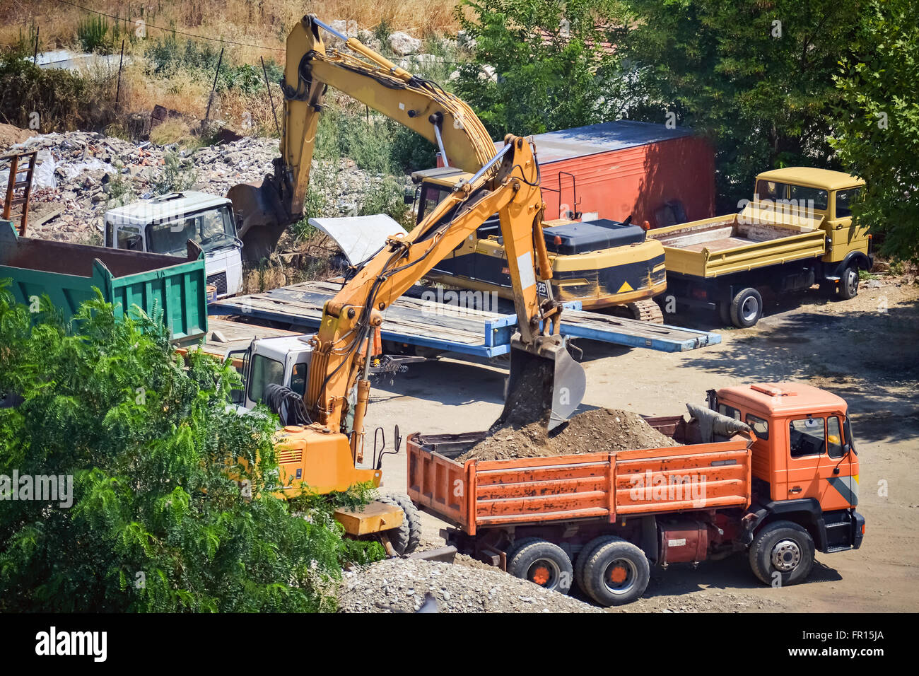Several industrial vehicles during the work at the construction site ...