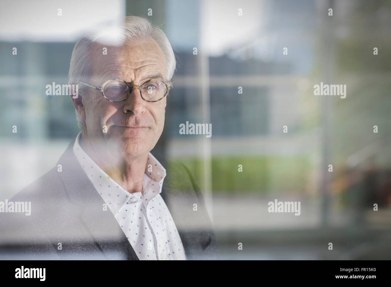 Portrait smiling senior businessman at window Stock Photo - Alamy Portrait smiling senior businessman at window Stock Photo - Alamy