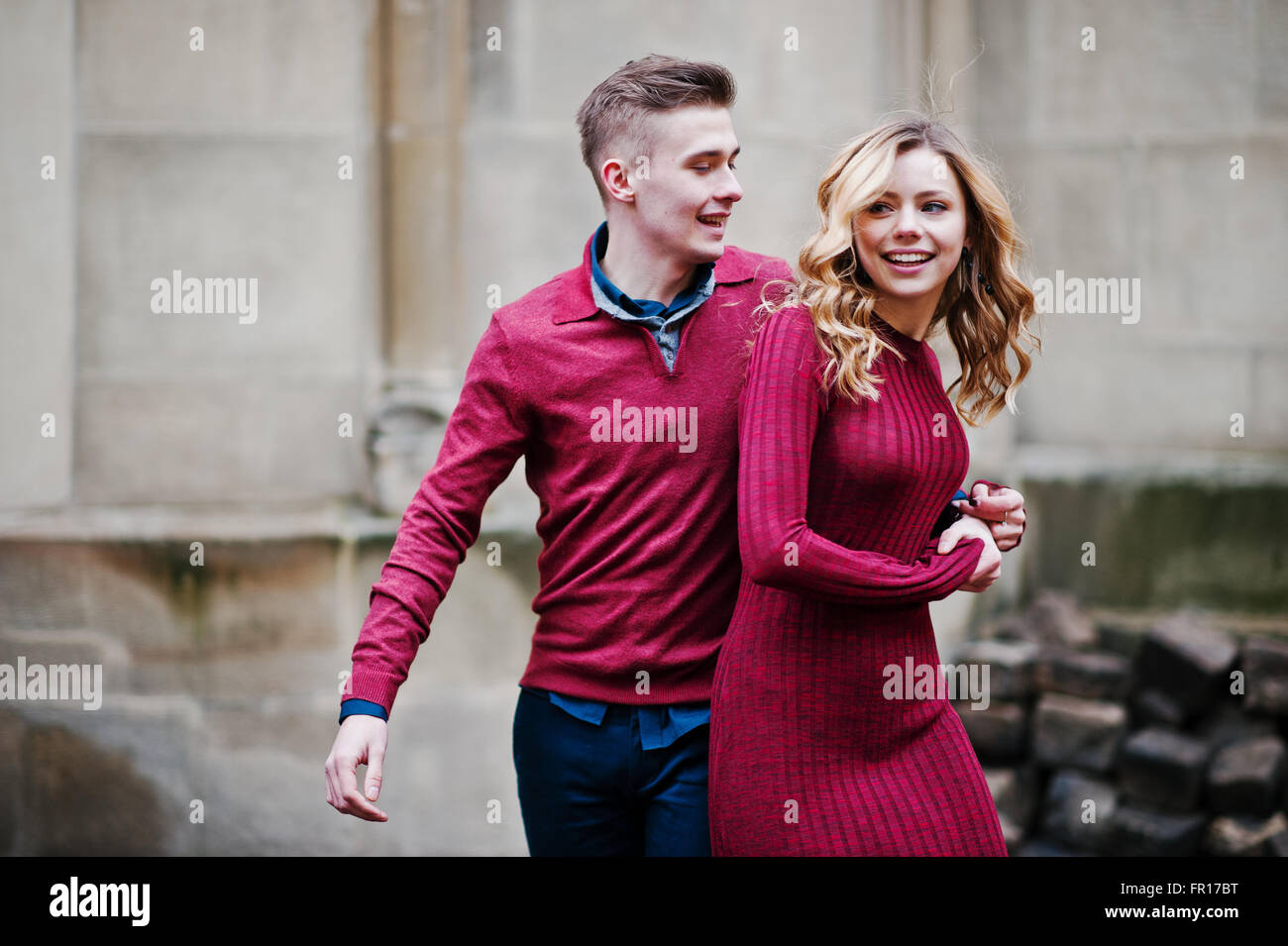 Young beautiful stylish fashion couple in a red dress in love story at ...