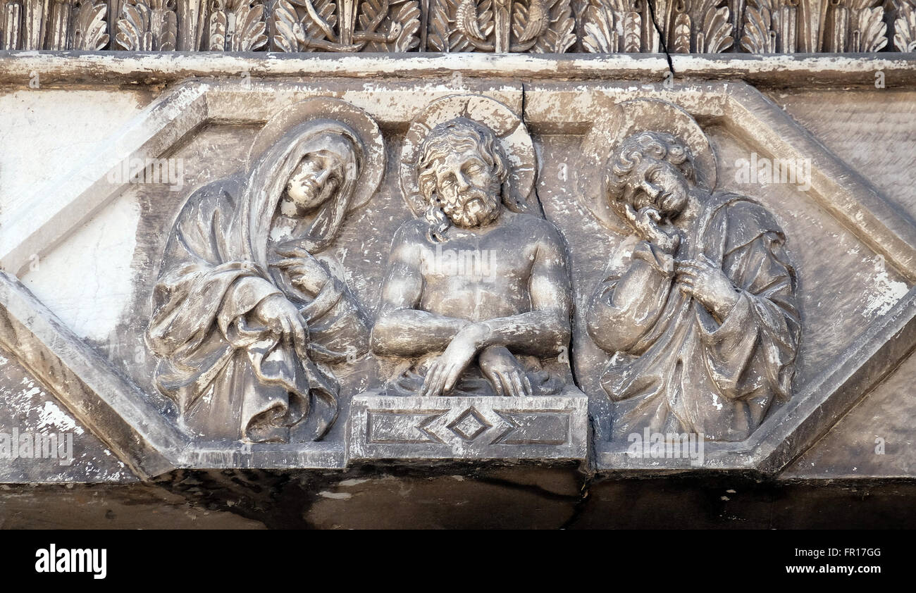 Jesus bound with the Virgin Mary and St. John on the portal of the ...