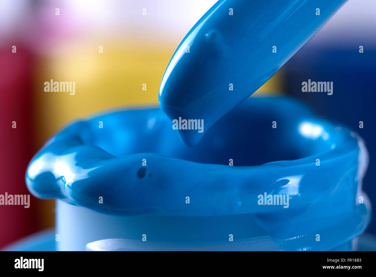 closeup of blue paint, container and paintbrush Stock Photo - Alamy