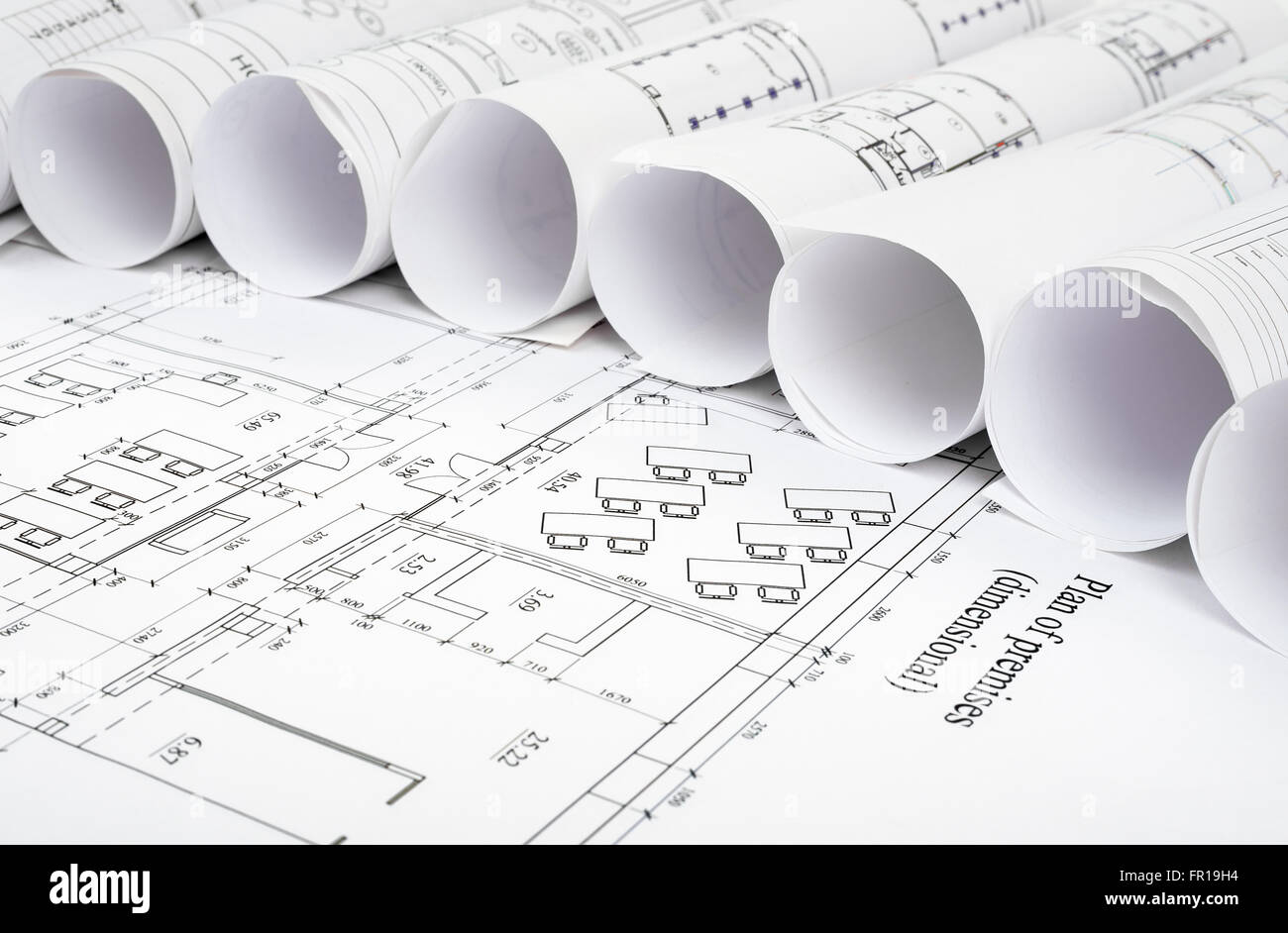 Blueprints and rolls of blueprints, side view. Building concept Stock ...