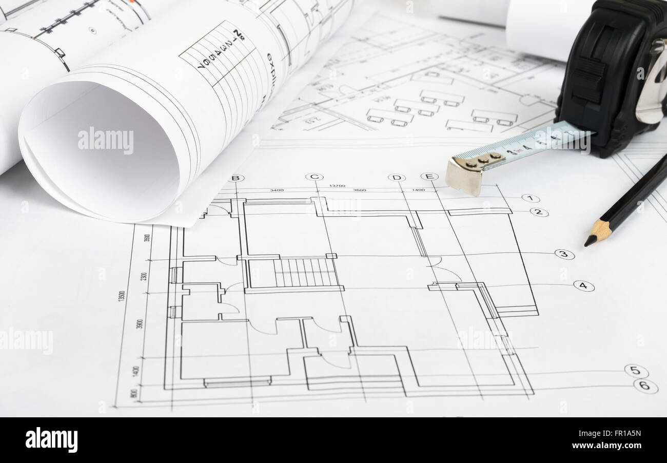 Architecture plan and rolls of blueprints with meter. Building concept ...