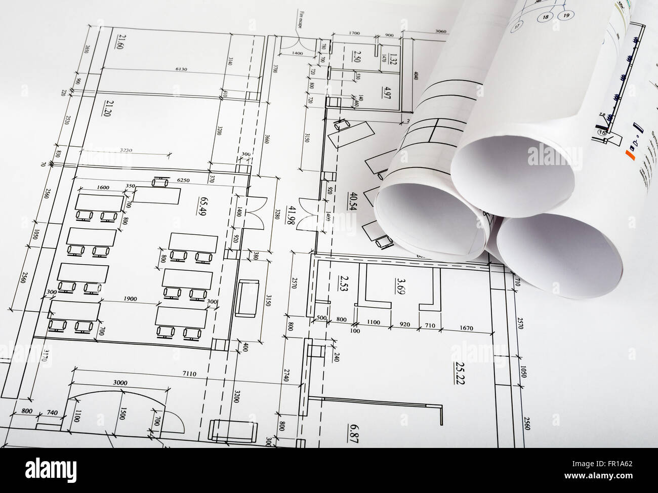 Blueprints and rolls of blueprints, side view. Building concept Stock ...
