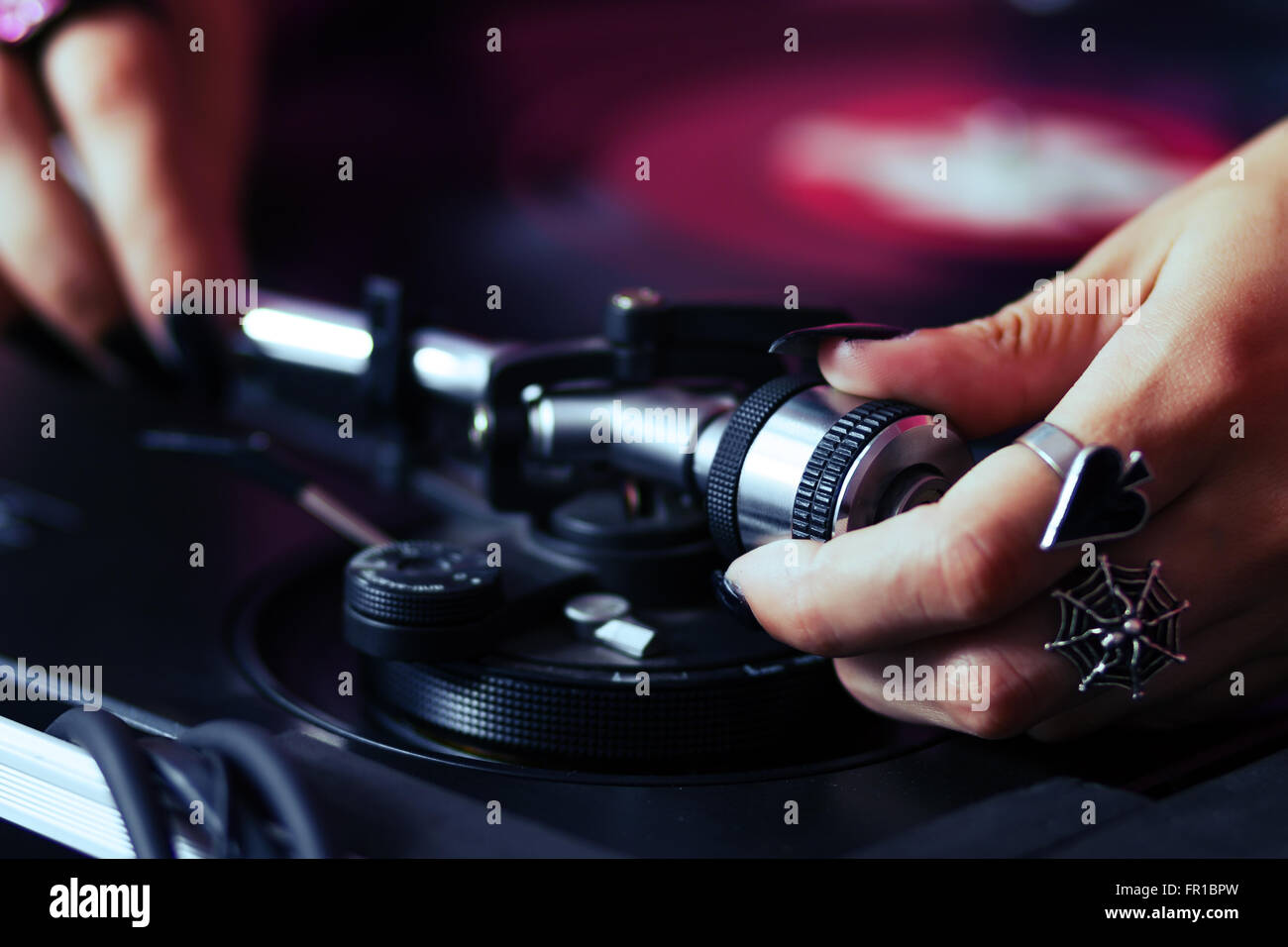 Woman playing a vinyl record hi-res stock photography and images - Alamy