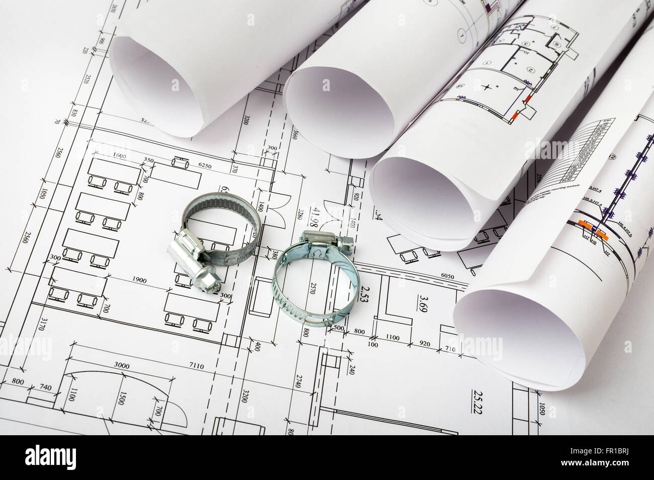 Architecture plan and rolls of blueprints Stock Photo - Alamy
