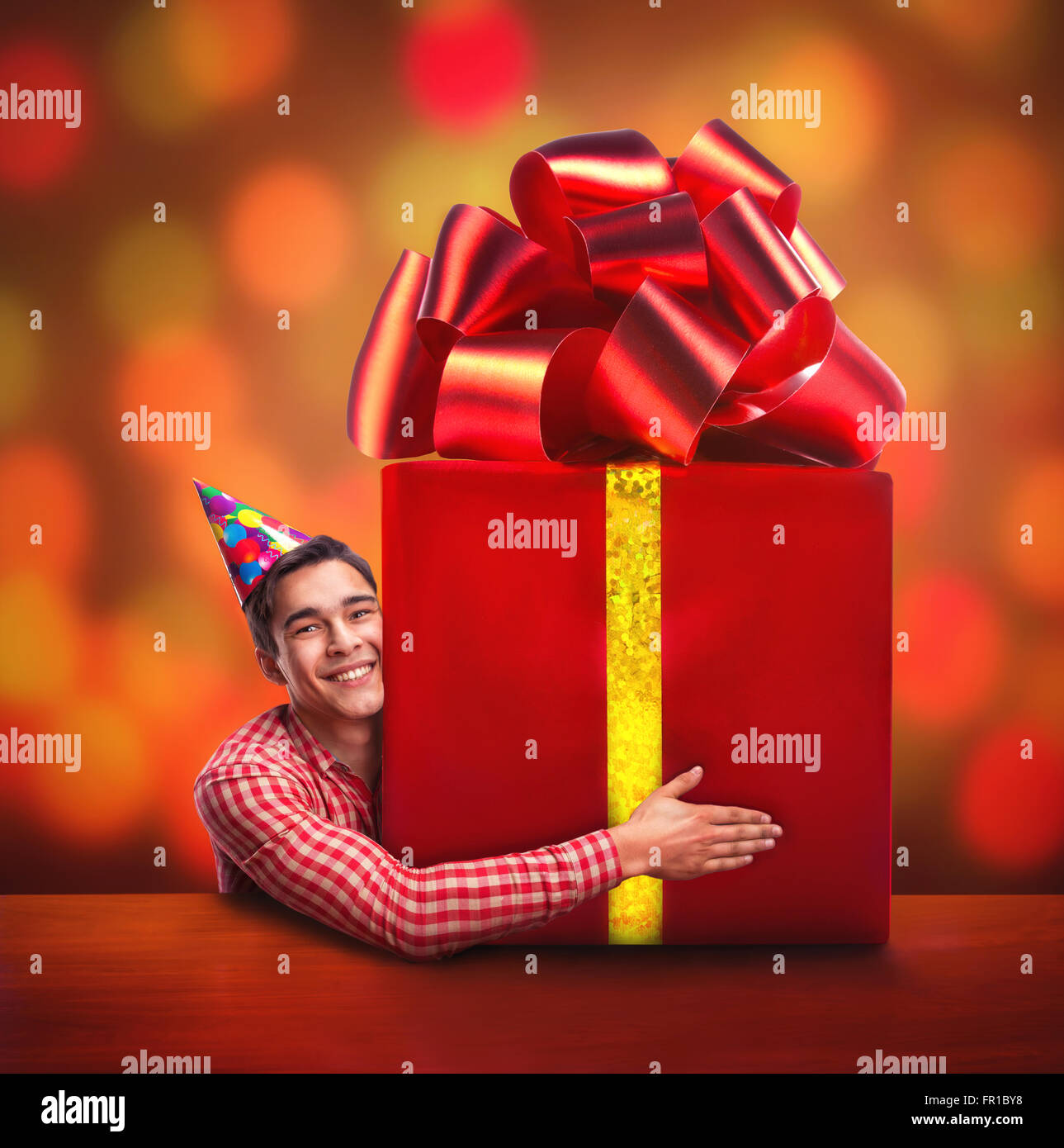 Man with a big gift Stock Photo - Alamy