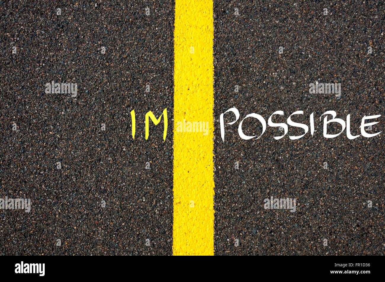 Road marking yellow paint dividing line between IM and POSSIBLE as word ...