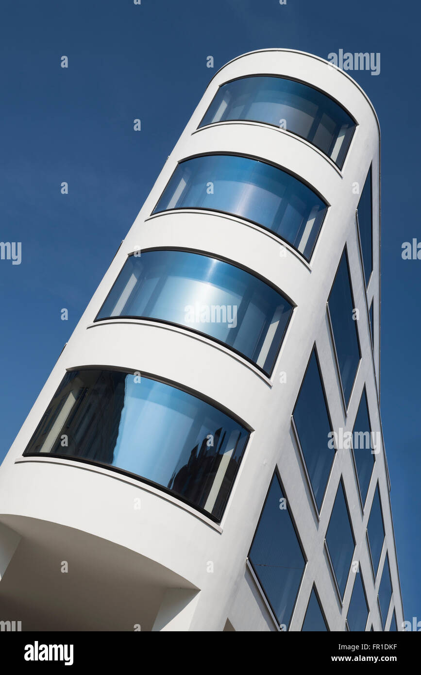 Modern architecture and facade with curved glass windows in a building ...