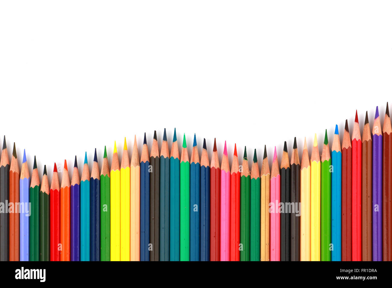 Colorful color pencil arranged in diagonal line on white background ...