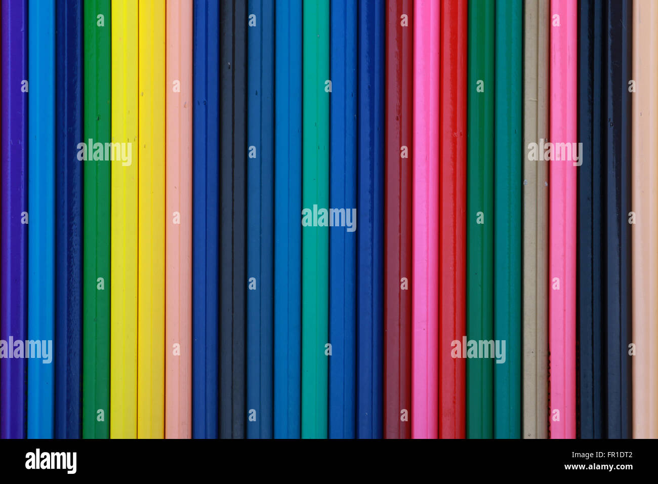 Colorful color pencil arranged in diagonal line on white background ...