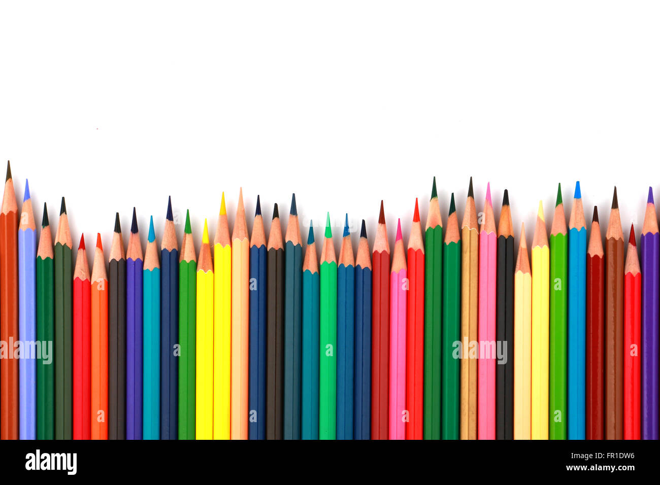 Colorful color pencil arranged in diagonal line on white background ...