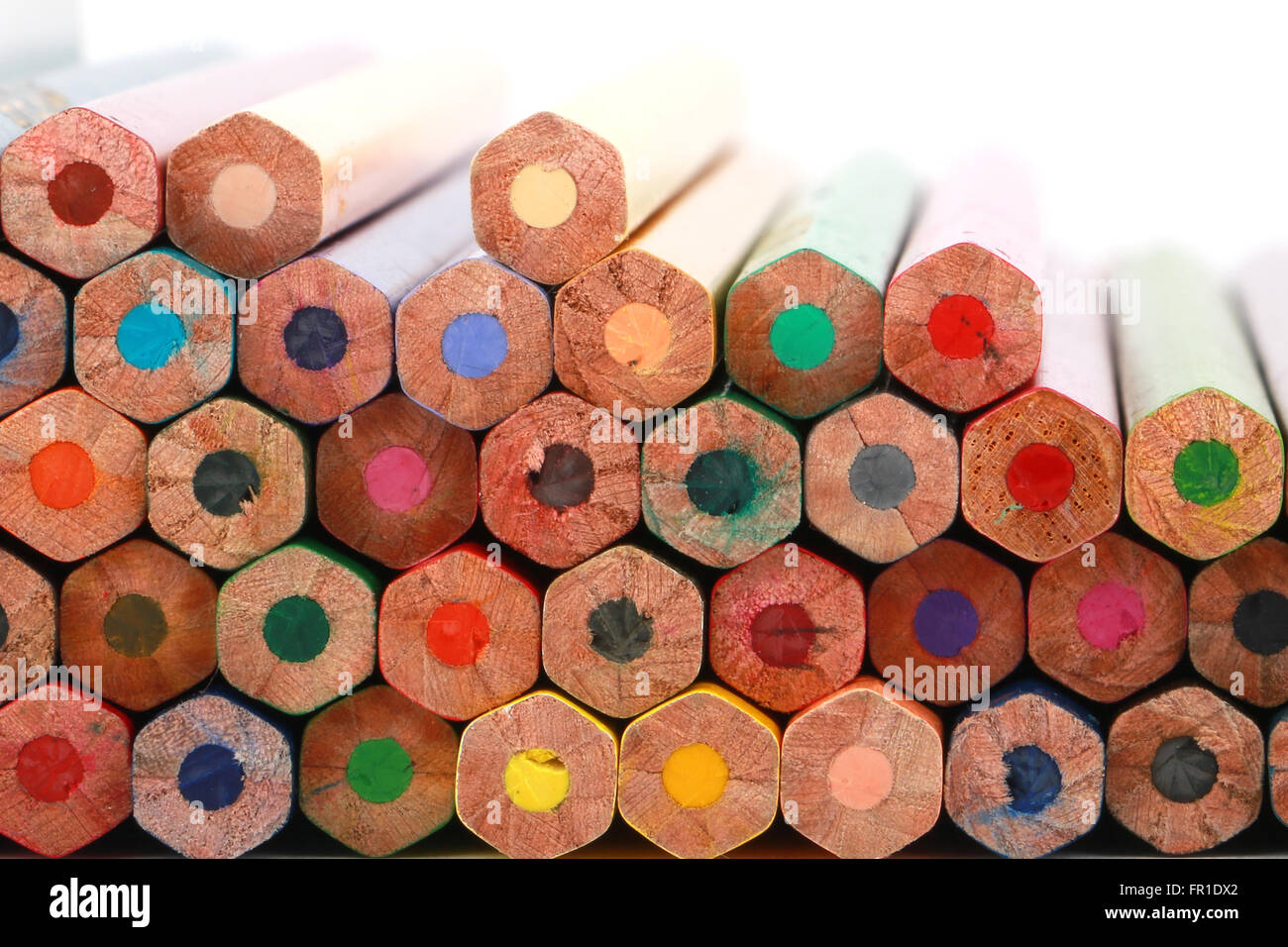 Colorful color pencil arranged in diagonal line on white background ...