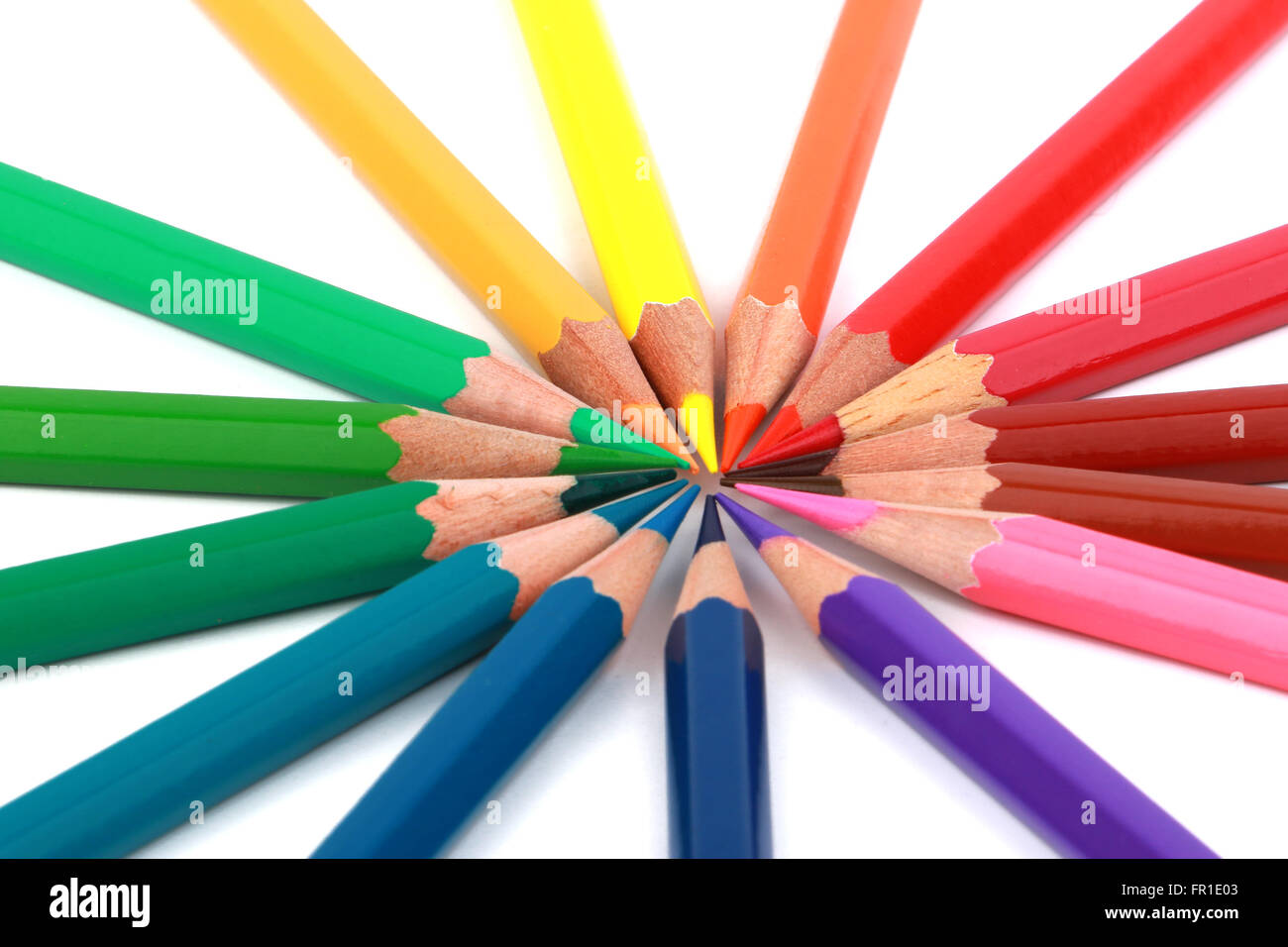 Colorful color pencil arranged in diagonal line on white background ...