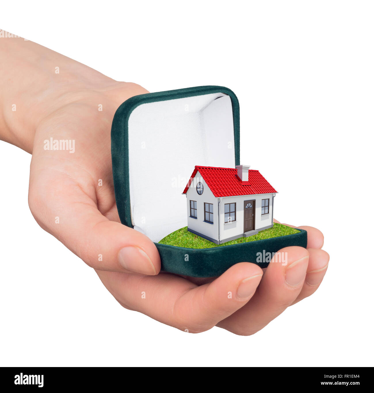 Hand holding ring box with house inside Stock Photo - Alamy