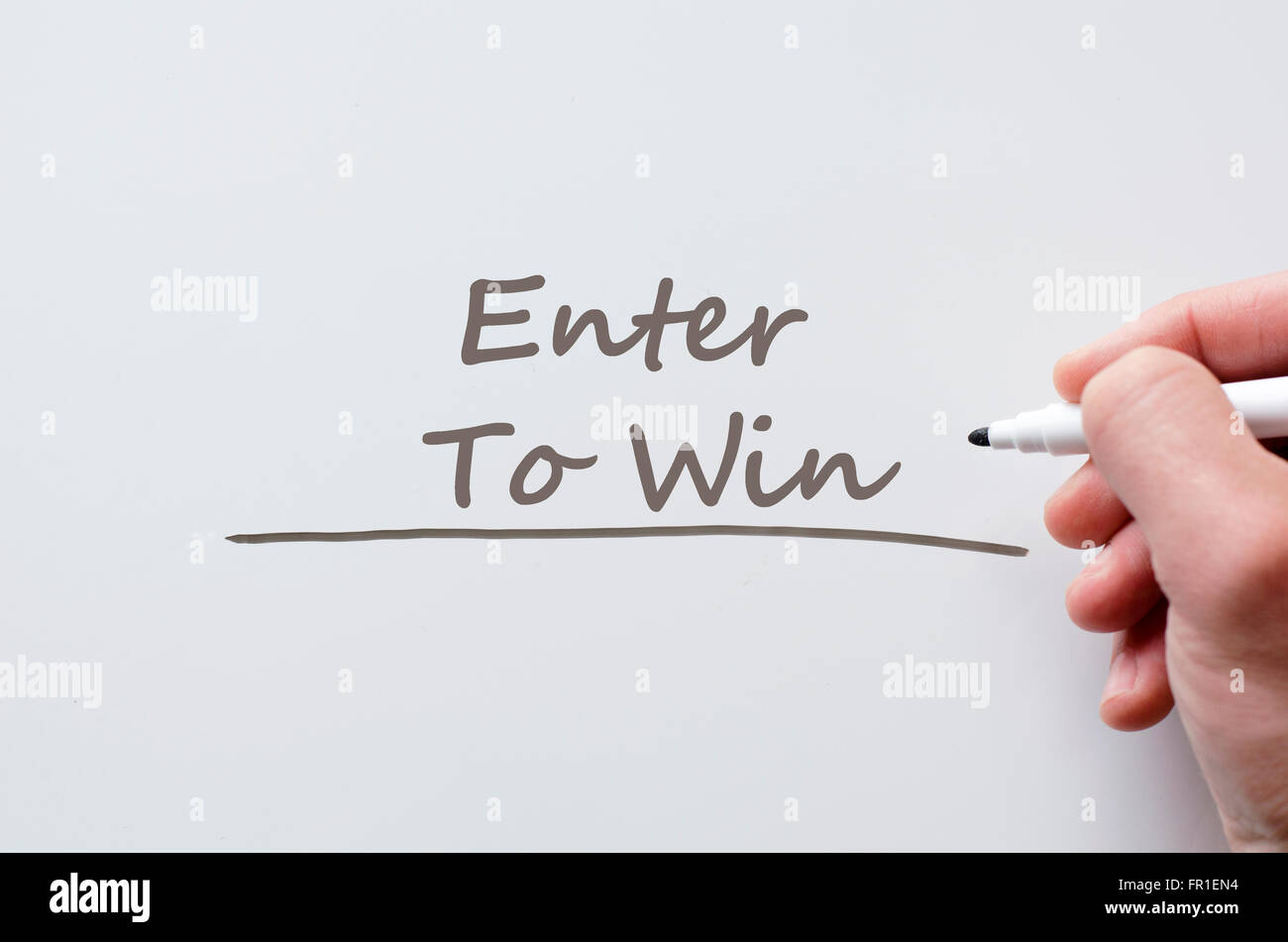 Human hand writing enter to win on whiteboard Stock Photo - Alamy