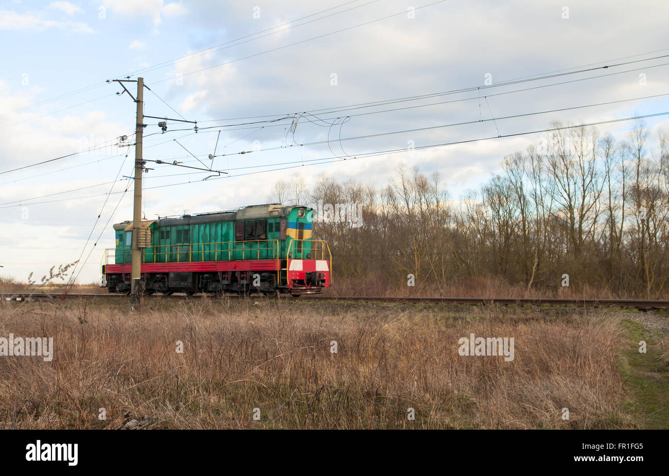 locomotive and train passes through rural section Stock Photo - Alamy