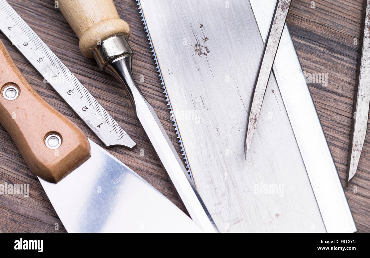 Image shows a set of tools on wooden table top view Stock Photo - Alamy