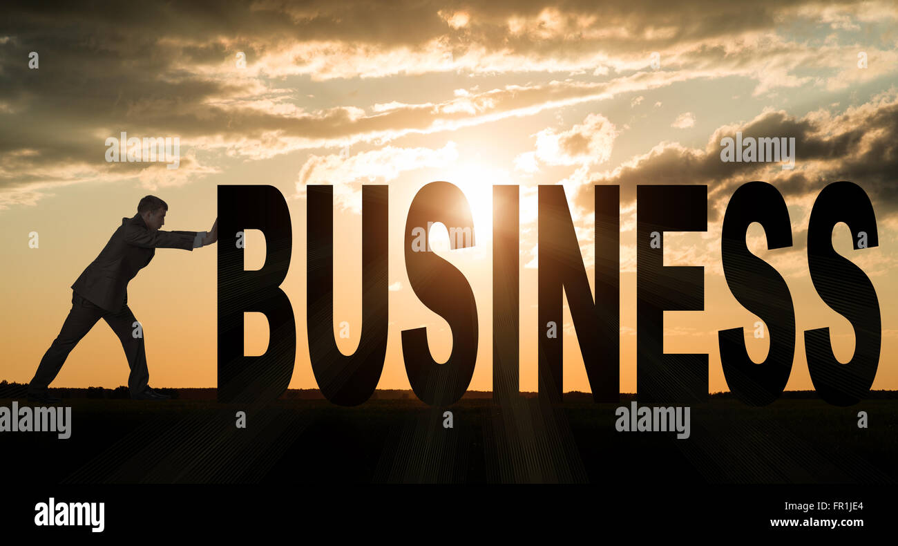 Businessman pushing word business Stock Photo - Alamy