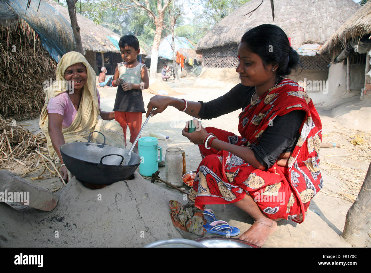 Traditional way of making food on open fire in old kitchen in a village ...