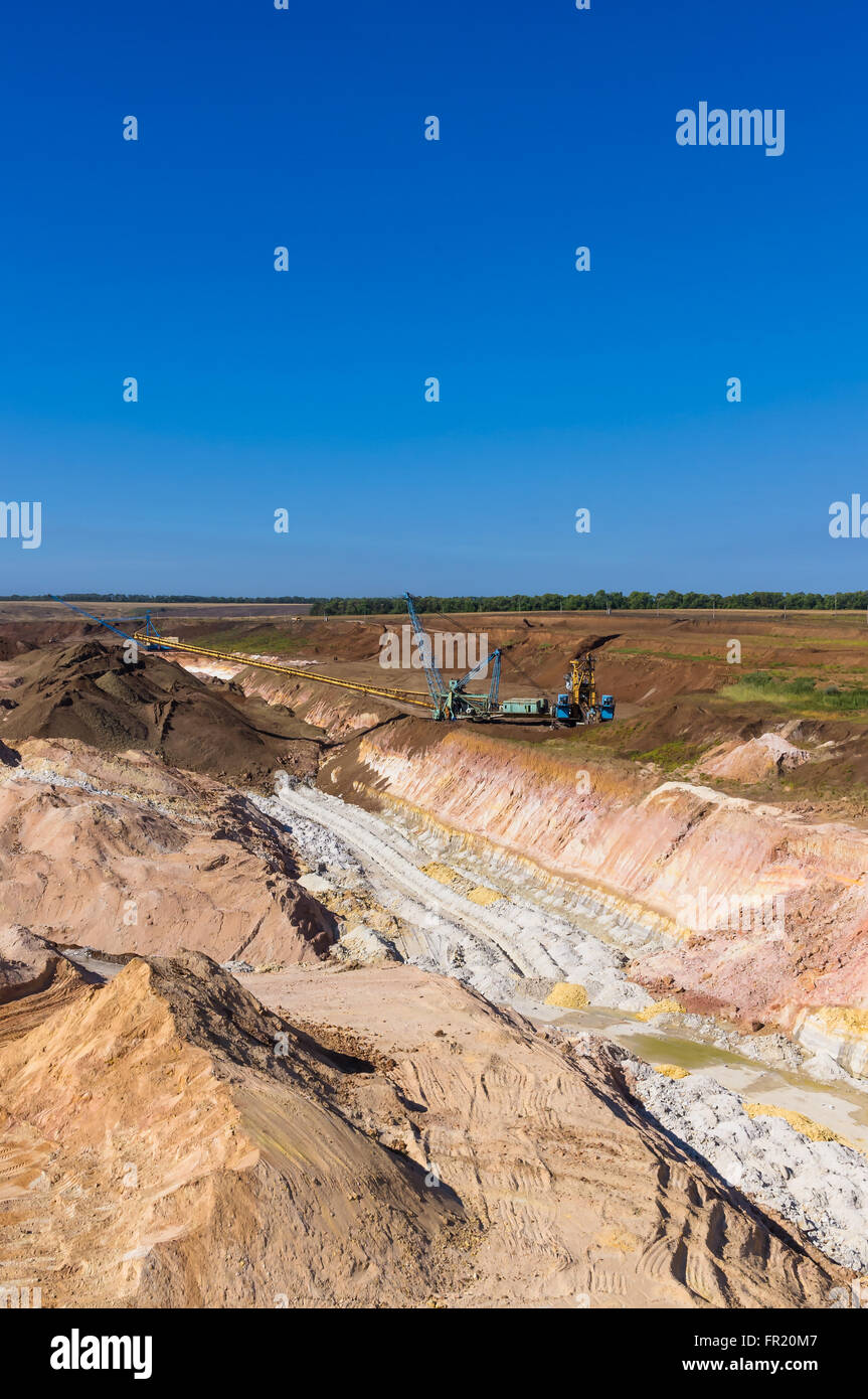 the big dipper dragline excavator digging clay on blue sky background ...