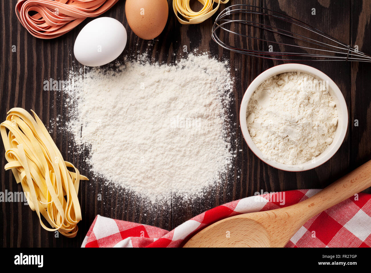 Homemade pasta cooking on wooden table. Top view with copy space Stock ...