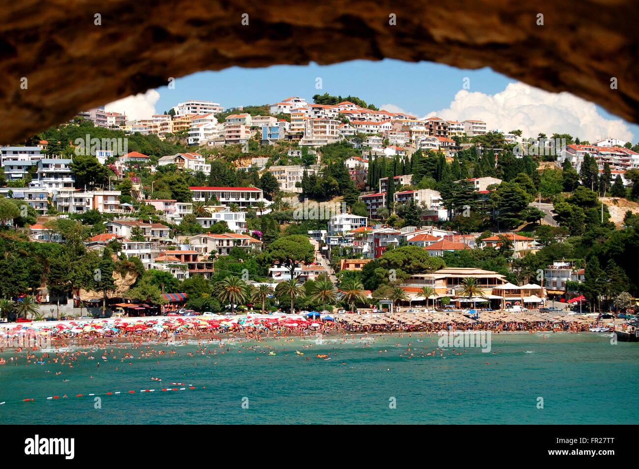 Crowded beach in Ulcinj, Montenegro. The beach is sandy, 375 m long and ...