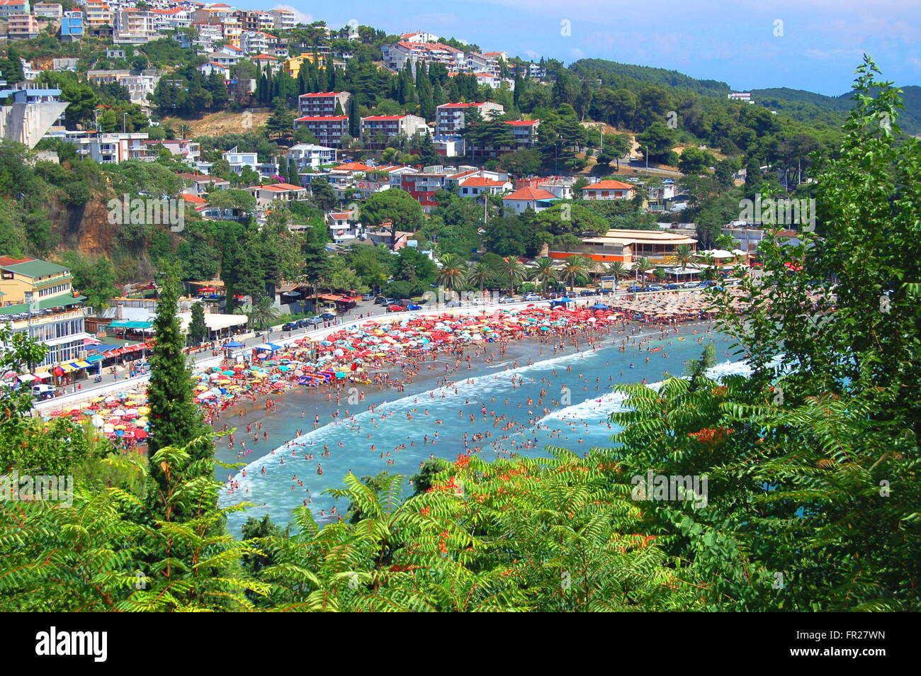 Crowded beach in Ulcinj, Montenegro. The beach is sandy, 375 m long and ...
