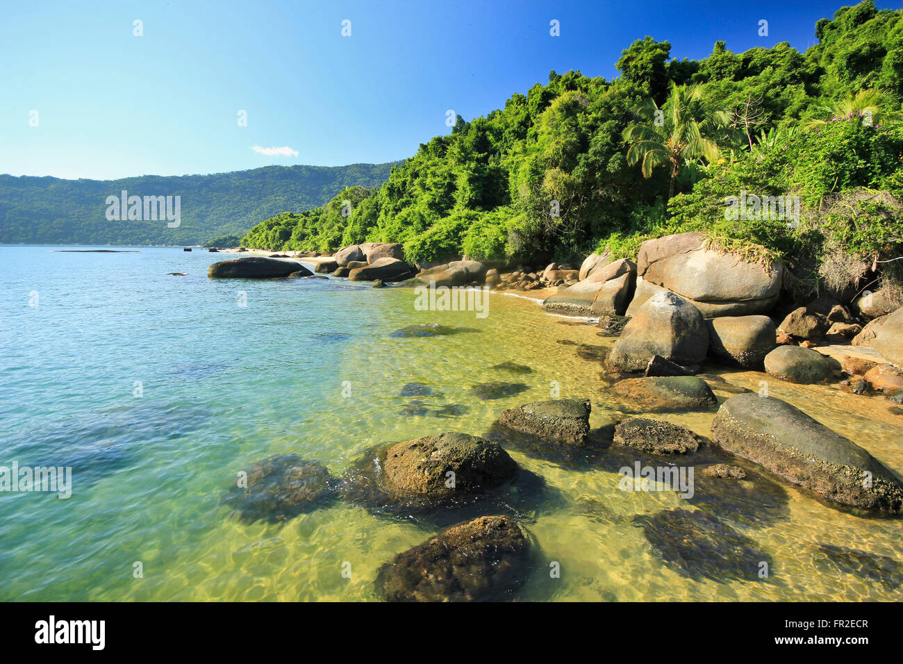 Tropical beach with stones hi-res stock photography and images - Alamy
