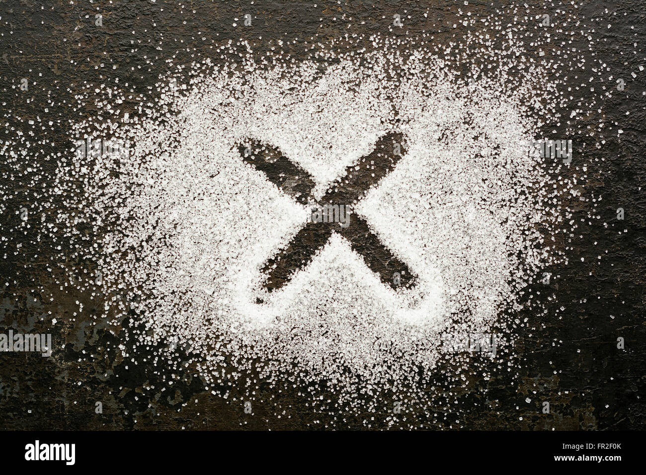 Cross drawn into sugar Stock Photo - Alamy