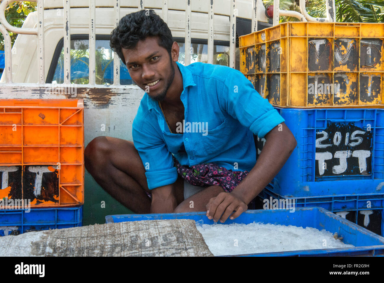 Man Unloading Ice Buckets From Truck, Fish Market, Andhakaranazhi Beach ...