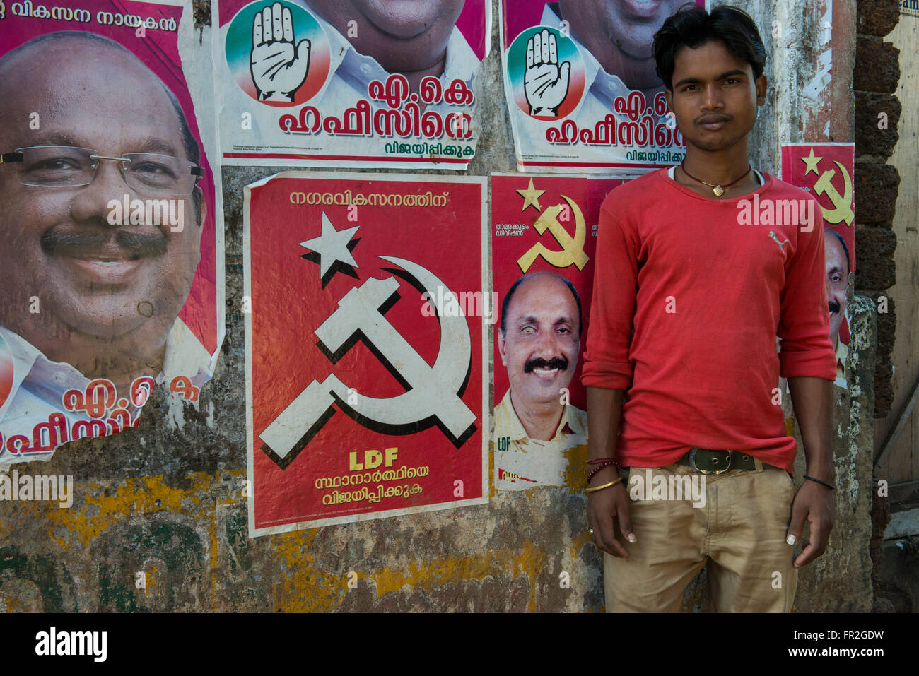Young Man In Front Of Communist Posters, Kollam Stock Photo - Alamy