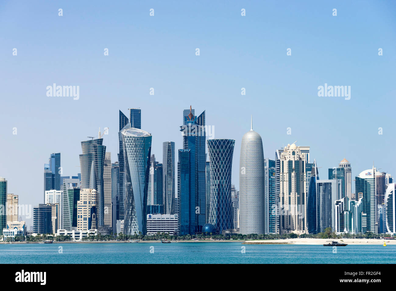 View along waterfront of Corniche towards modern office towers in West ...