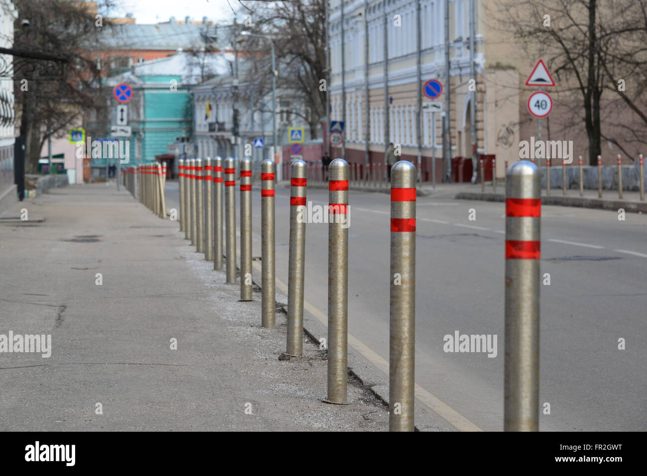 Moscow, Russia. Fence of columns along the road in the alley ...