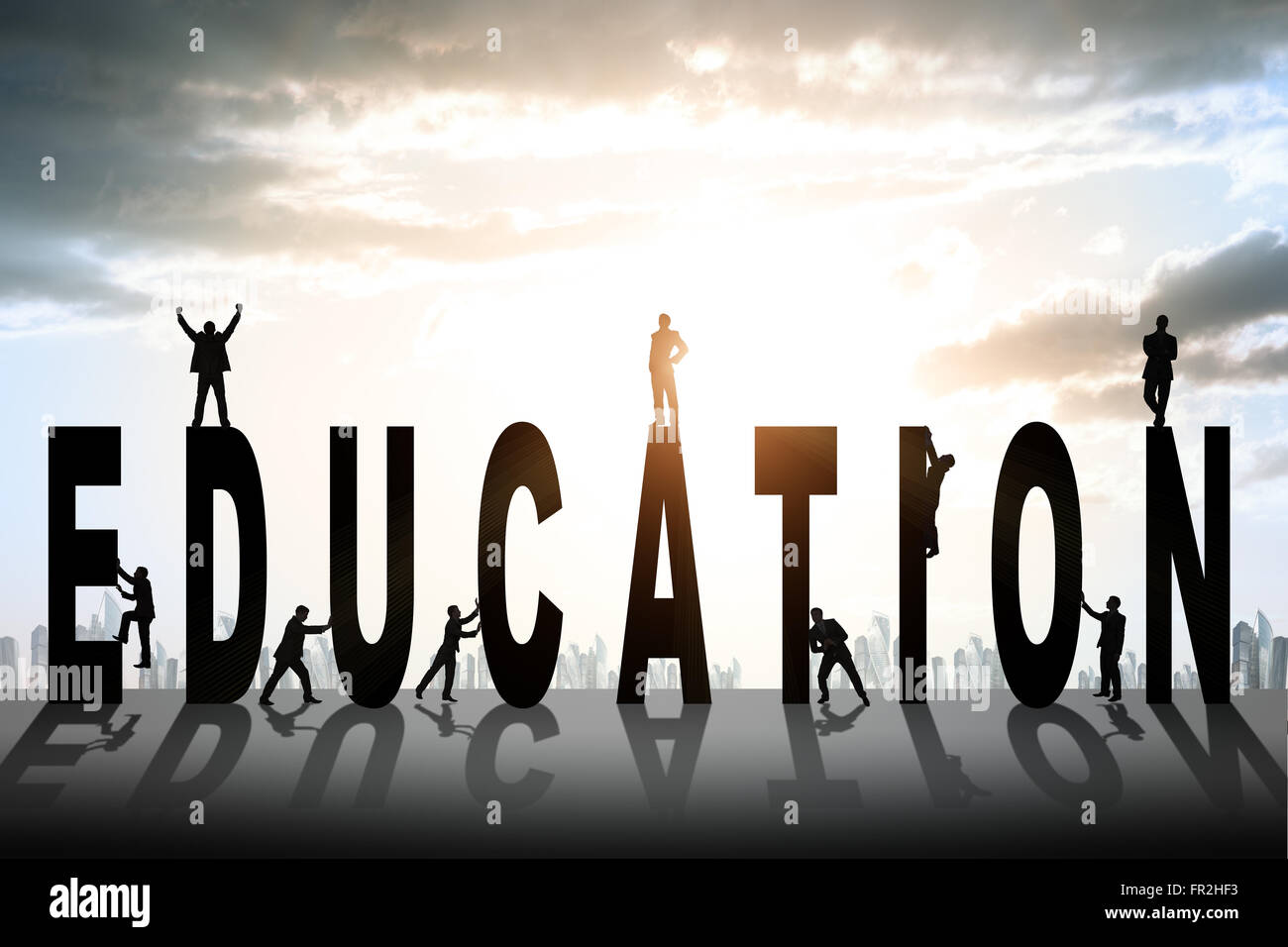 Set of businessmen pushing word education Stock Photo - Alamy