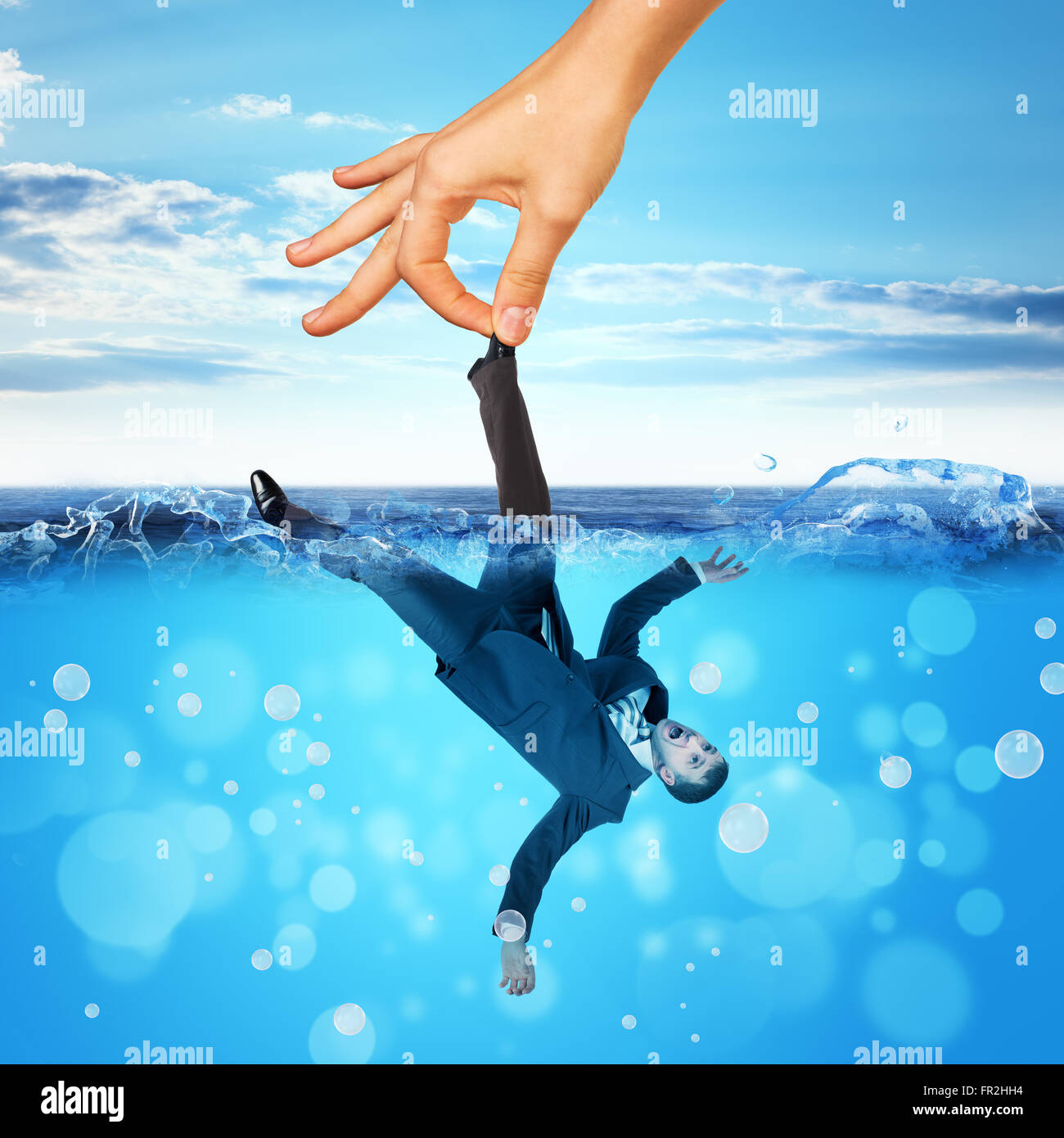 Businessman drowning in sea Stock Photo - Alamy