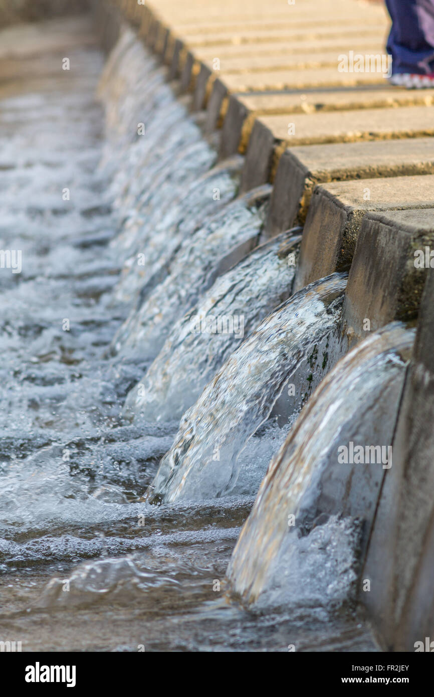 A segmented concrete bridge allows for water to pass through creating ...